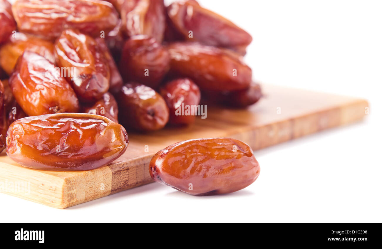 Dried dates isolated on a white background Stock Photo - Alamy