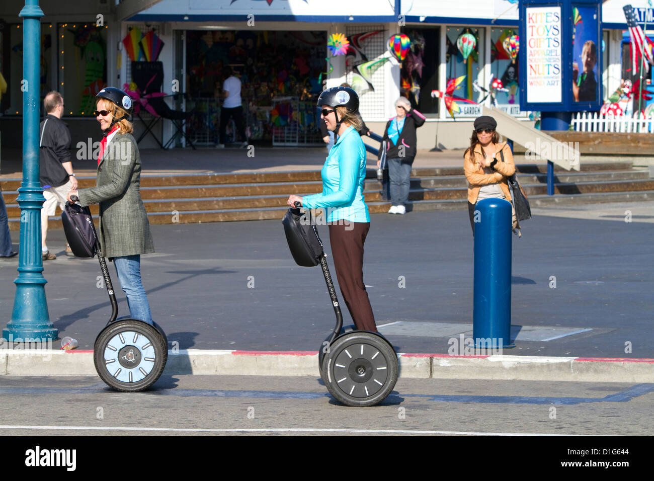 People ride a Segway PT near Pier 39 in San Francisco, California, USA ...
