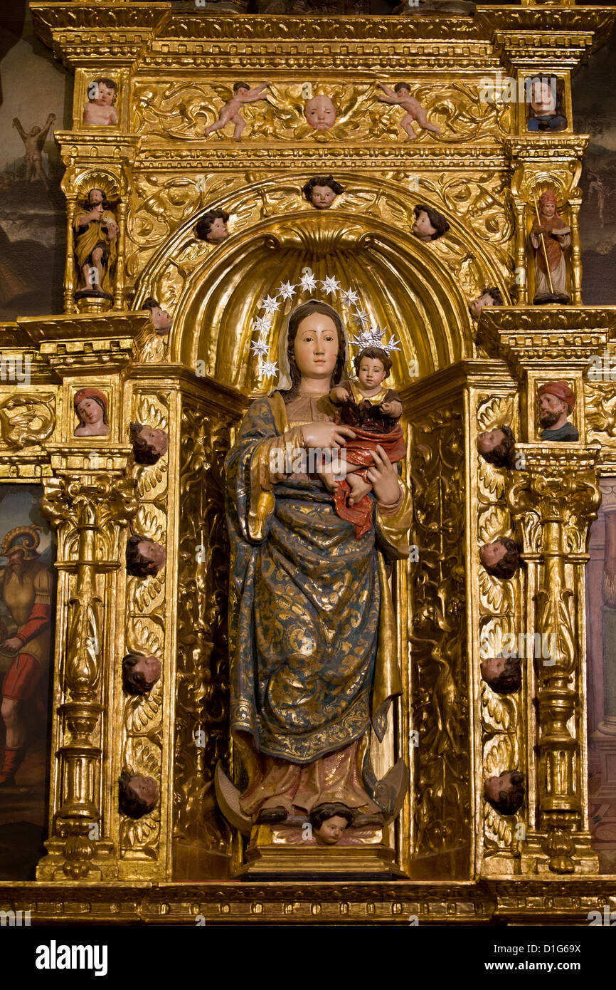 Historic reliefs of Virgin Mary with baby Jesus Christ inside gilded ...