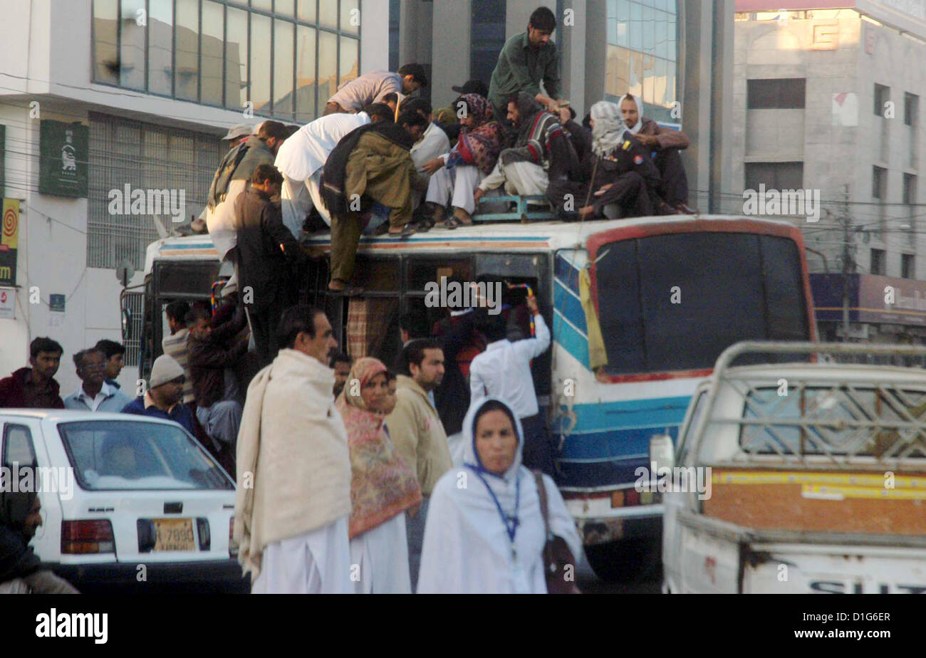 Passengers travel on an overload bus due to non-availability of ...