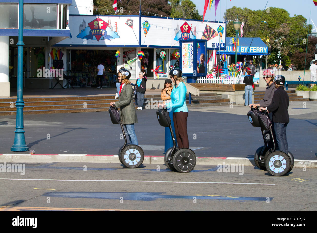 People ride a Segway PT near Pier 39 in San Francisco, California, USA ...