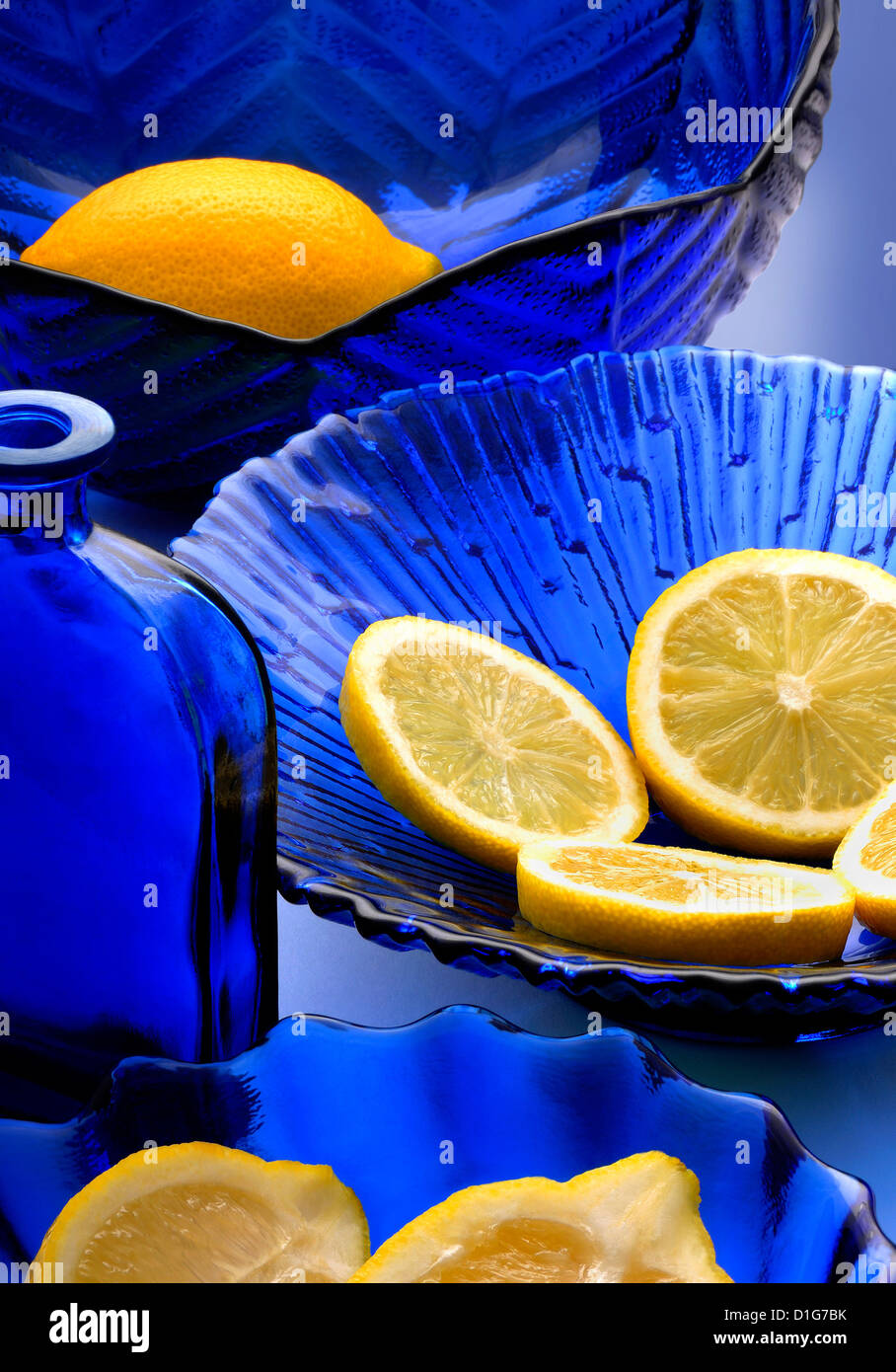 blue glass and lemons Stock Photo - Alamy
