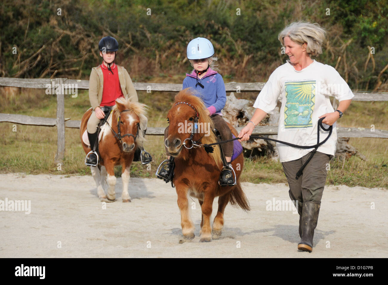 Children learning to ride horses hi-res stock photography and images ...