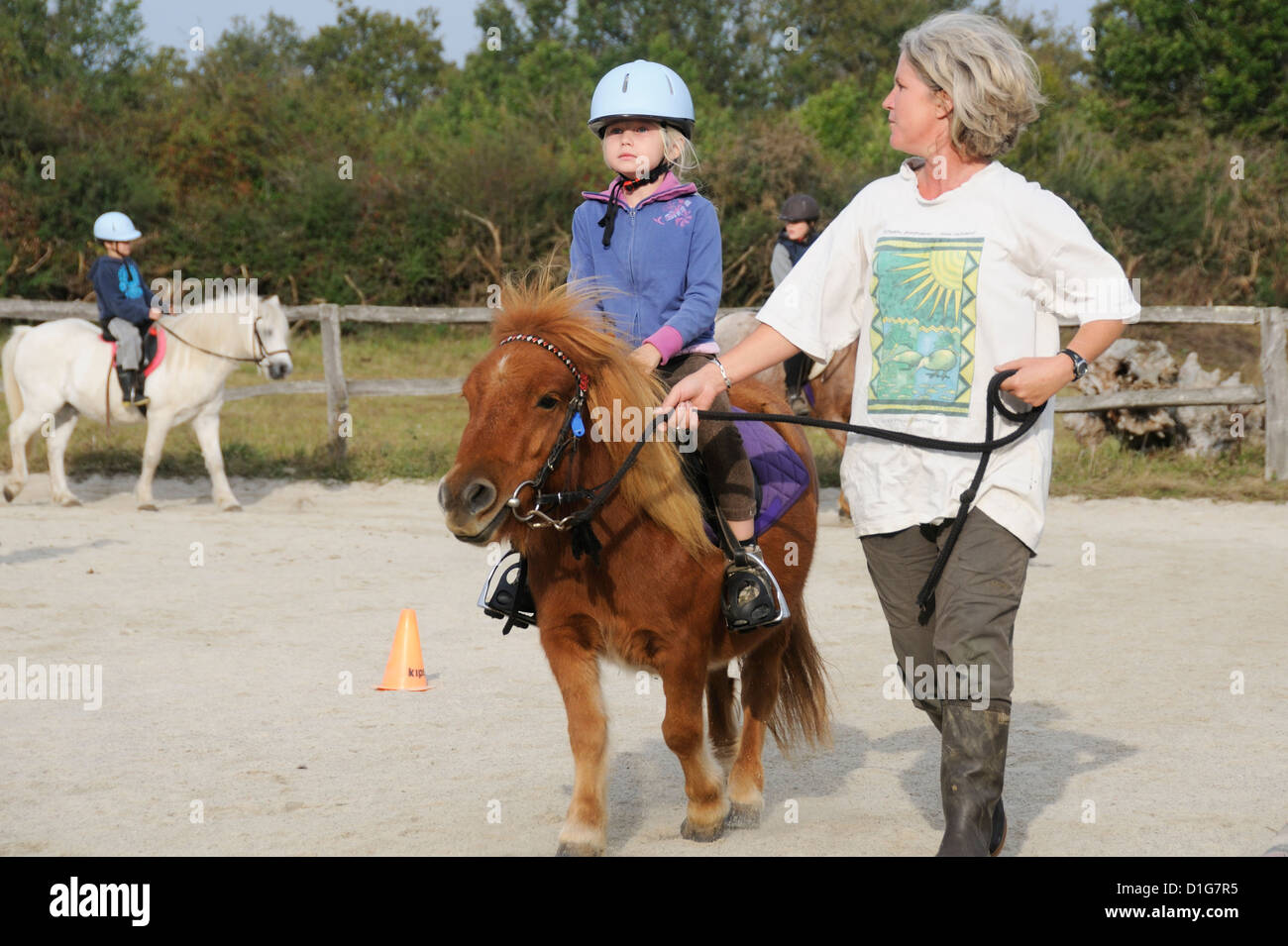 Stock photo of children learning to ride Stock Photo - Alamy