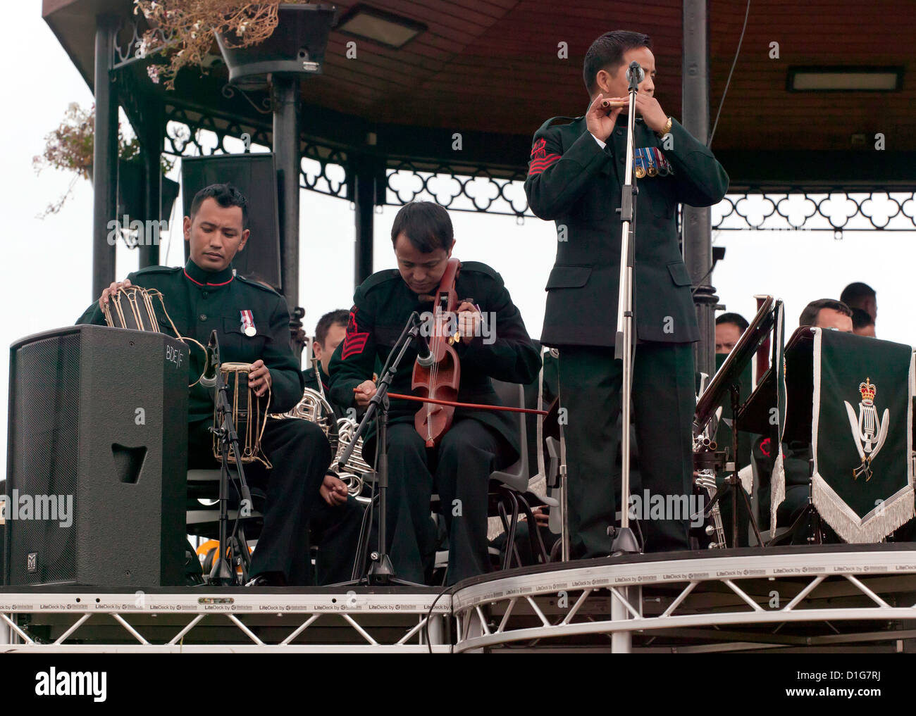 Members of the Regimental Band of The Brigade of Gurkhas performing on ...