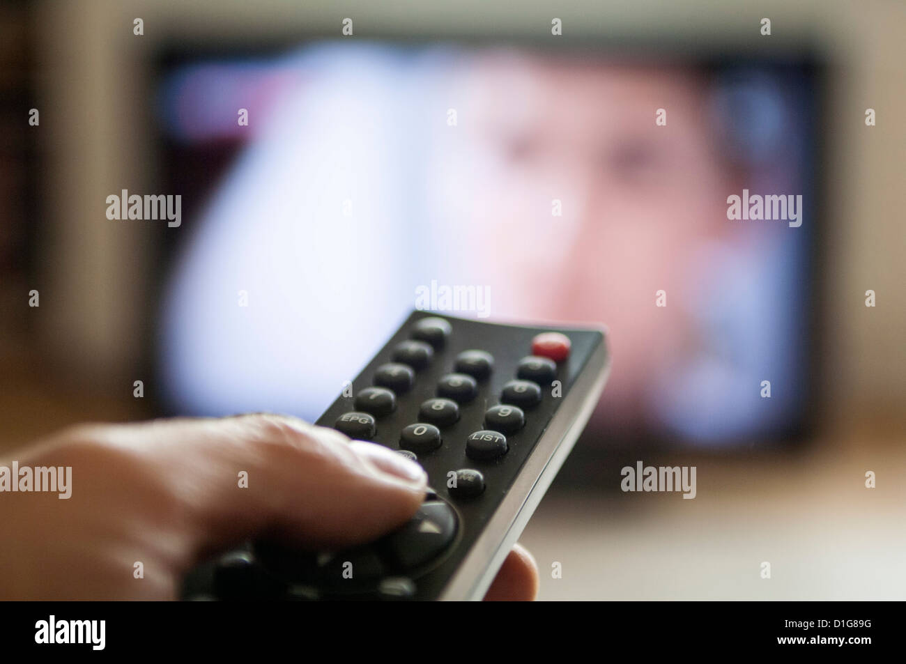 Hand with Remote Control of TV Stock Photo - Alamy