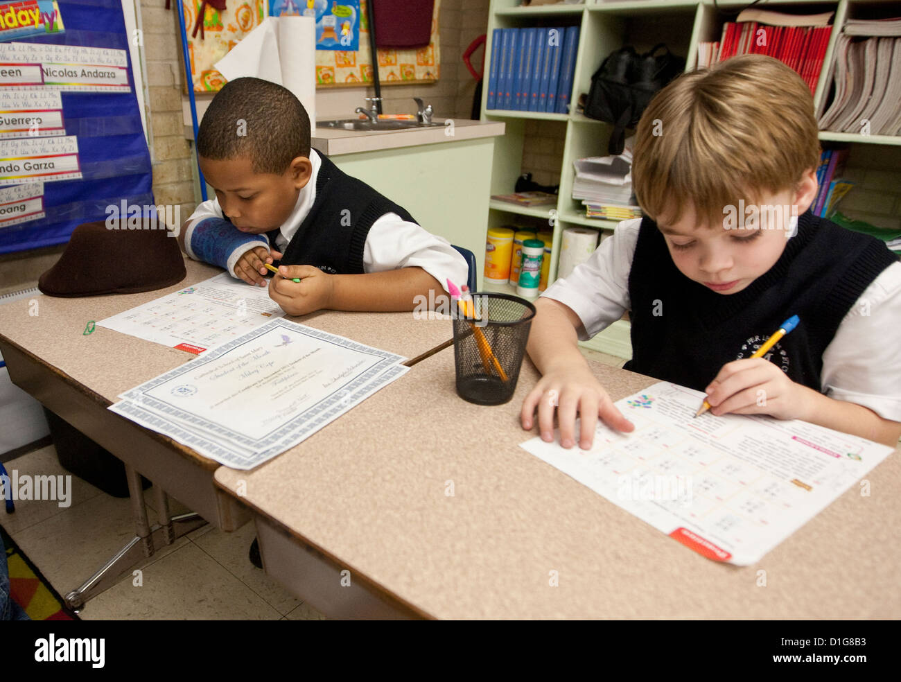 Second grade elementary school children wearing uniforms complete ...