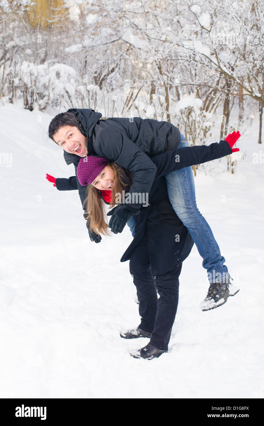 A nice couple playing in the snow Stock Photo - Alamy