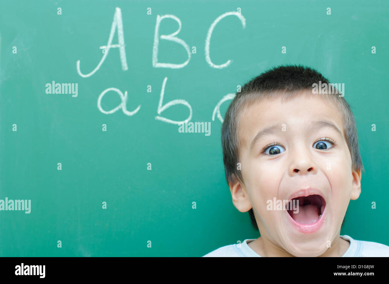 Little Boy Screaming Very Happy at Blackboard Stock Photo - Alamy
