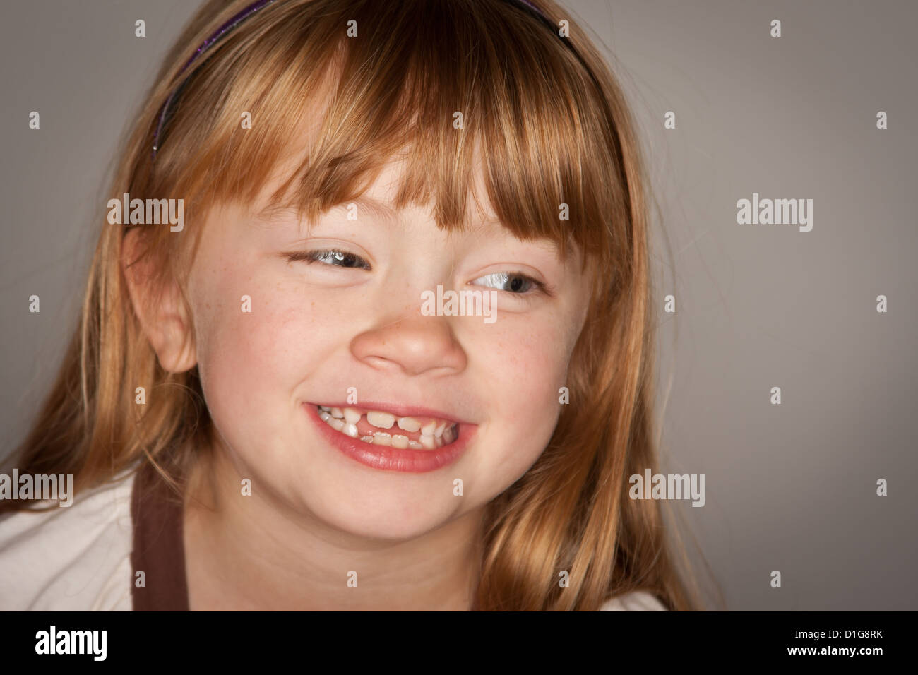 Fun Portrait of an Adorable Red Haired Girl on a Grey Background Stock ...