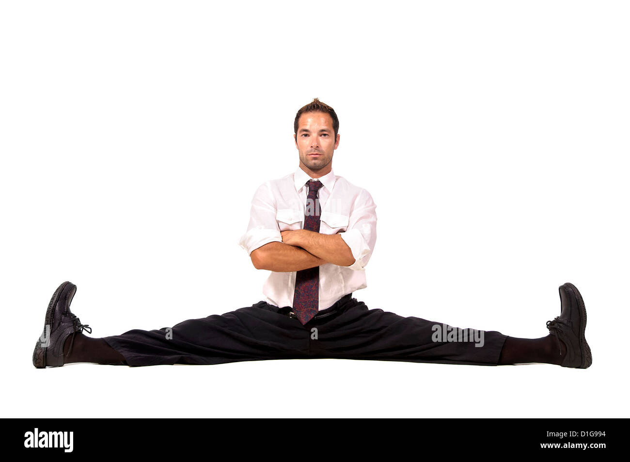Businessman doing splits on the floor Stock Photo - Alamy