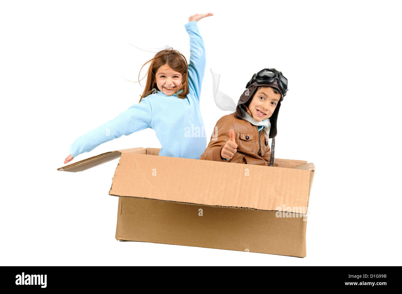 Young couple pilot flying a cardboard box isolated in white Stock Photo ...