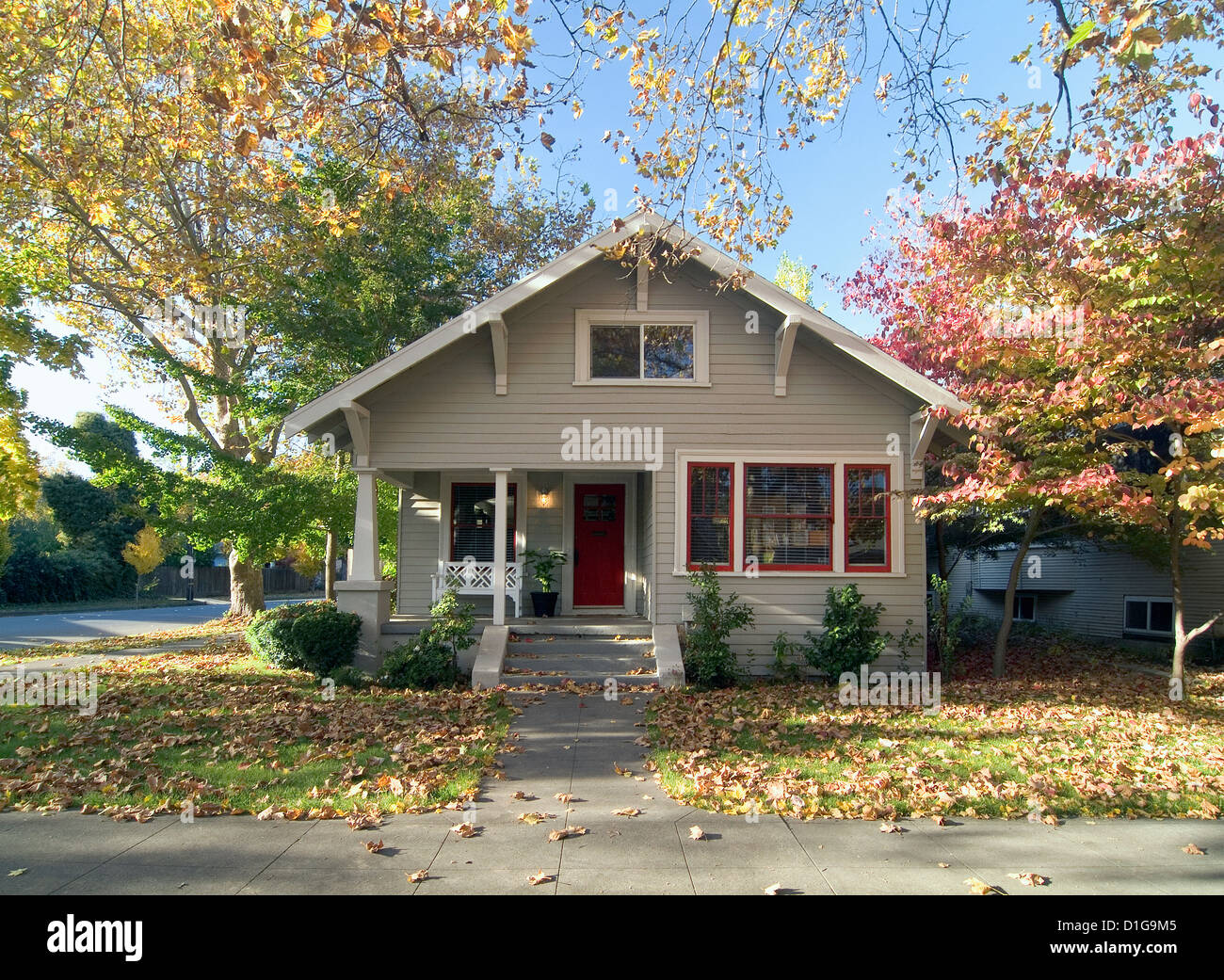 Front exterior gray bungalow with red door; Chico; California; USA ...