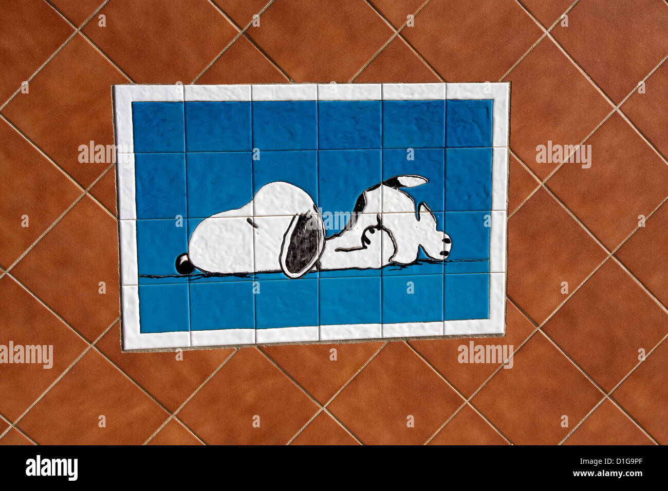 Snoopy, cartoon character, on tiles outside nursery, Nerja, Spain ...