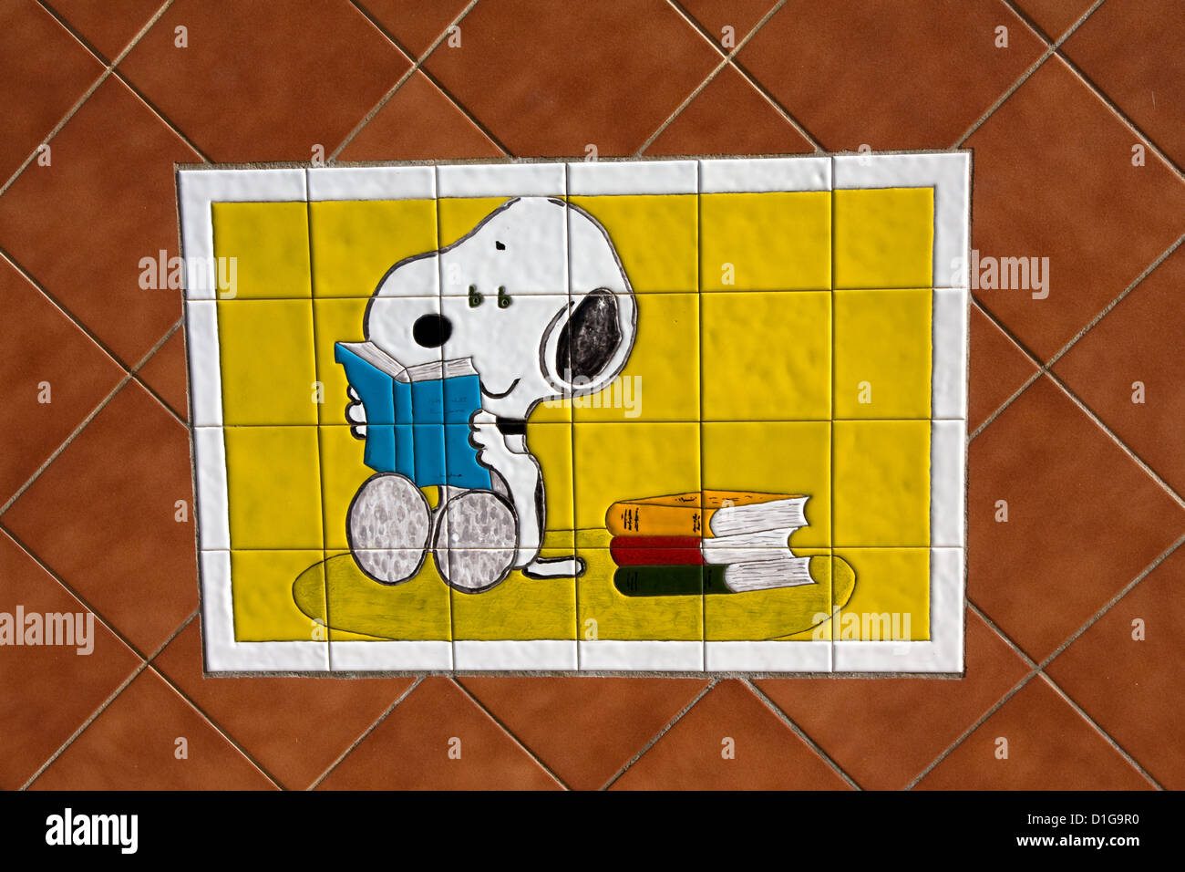 Snoopy, cartoon character, on tiles outside nursery, Nerja, Spain ...
