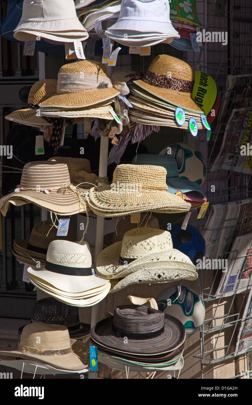 Stand of straw hats for sale; men & women's Stock Photo - Alamy