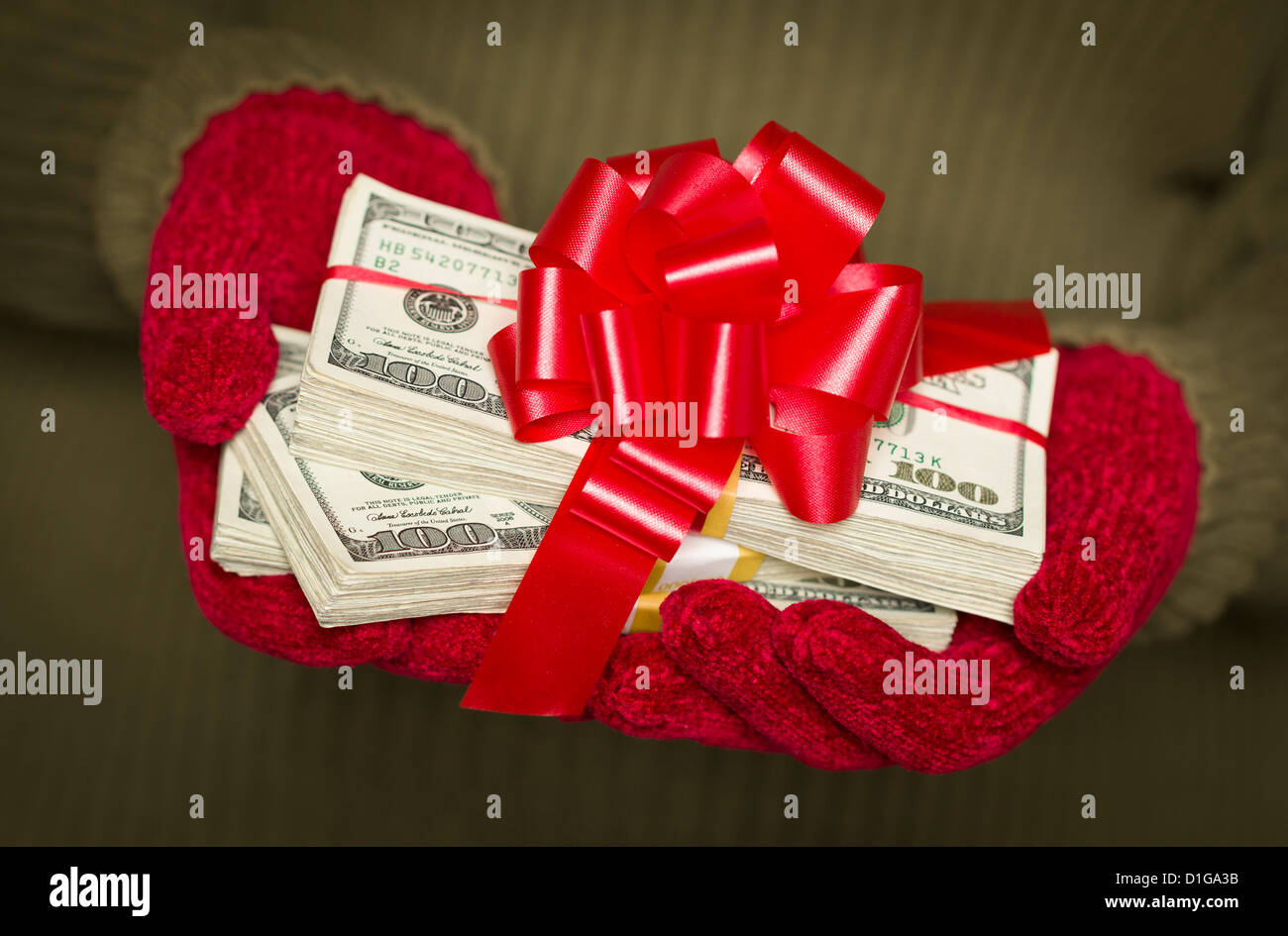 Woman Wearing Red Mittens and Green Sweater Holding Stacks of Hundreds ...