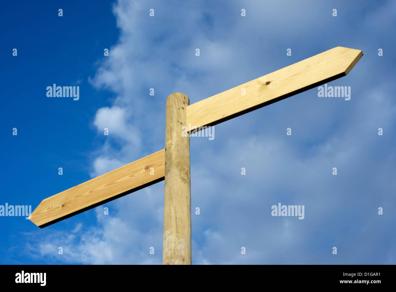 view of two wooden directional signs on a pole Stock Photo - Alamy