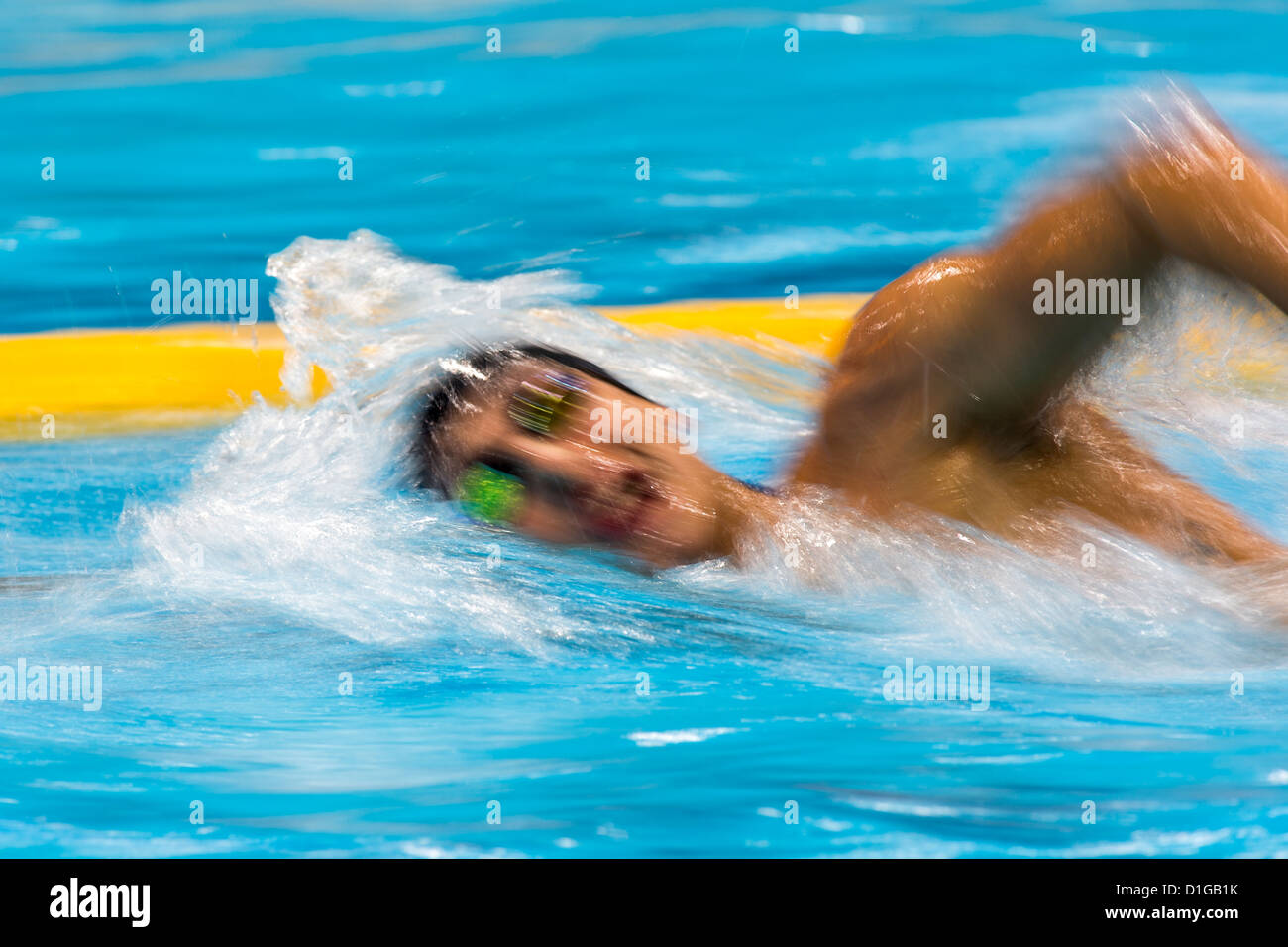 Male swimmer in freestyle action Stock Photo - Alamy