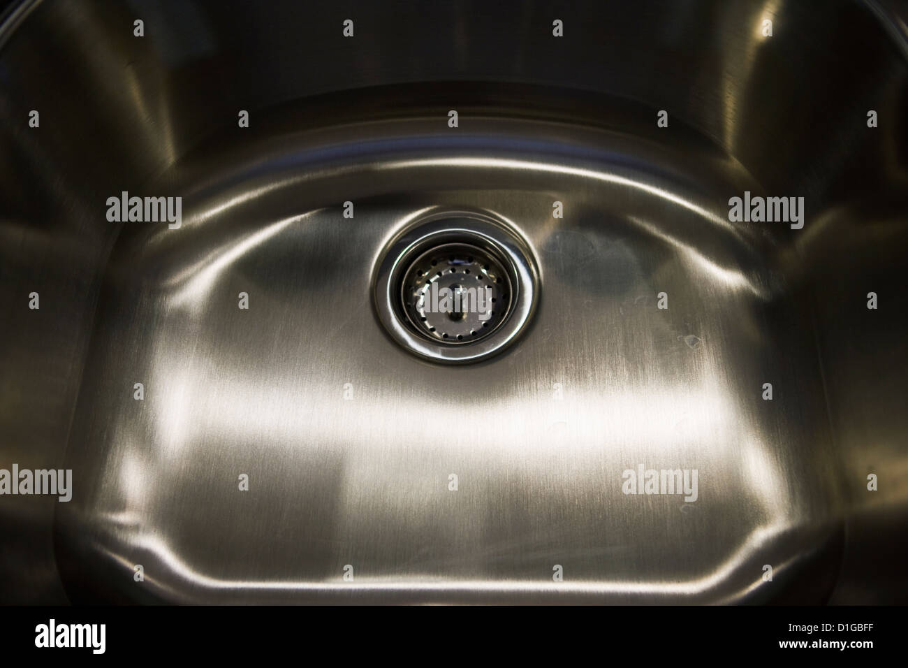 Drain in stainless steel kitchen sink; San Diego; California; USA Stock ...