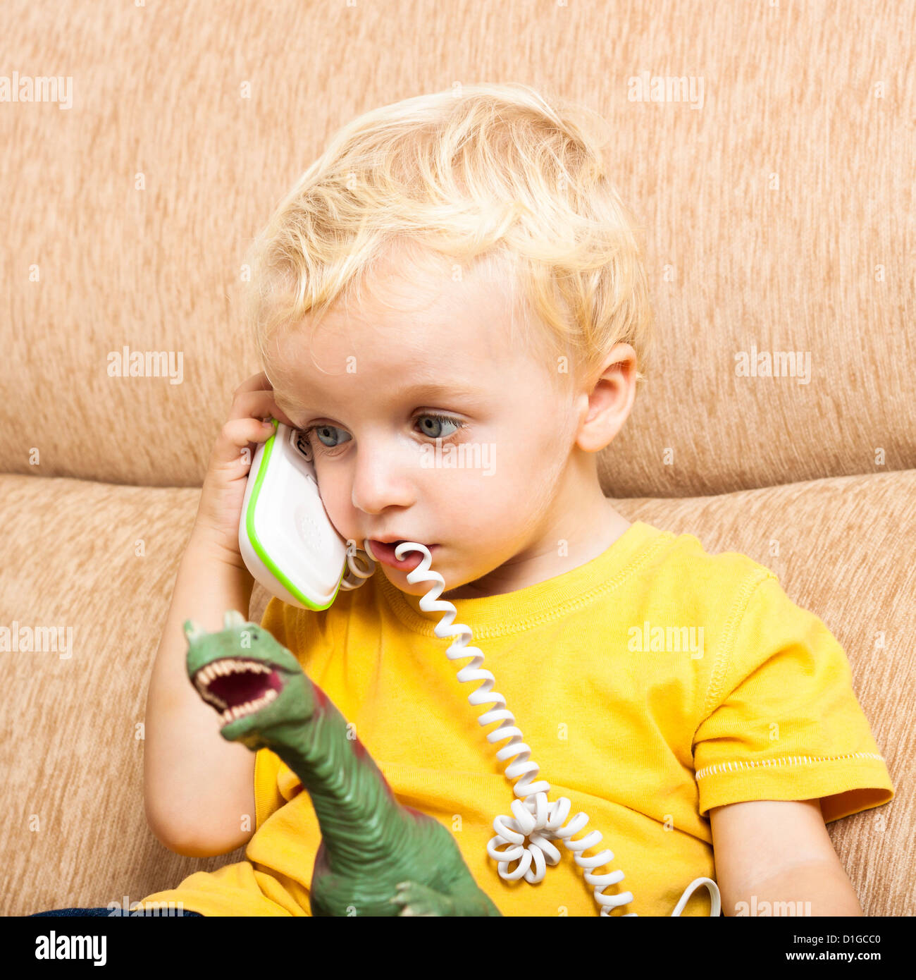 Close up of funny cute child boy playing with phone Stock Photo - Alamy