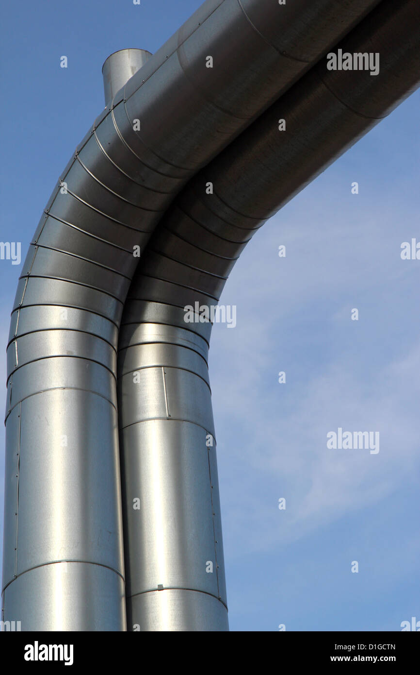 detail of steel glossy pipe and blue sky Stock Photo - Alamy