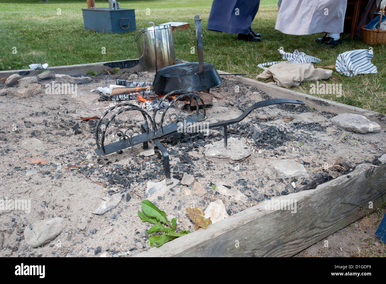 Bread toaster over hot coals used to recreate cooking process during ...