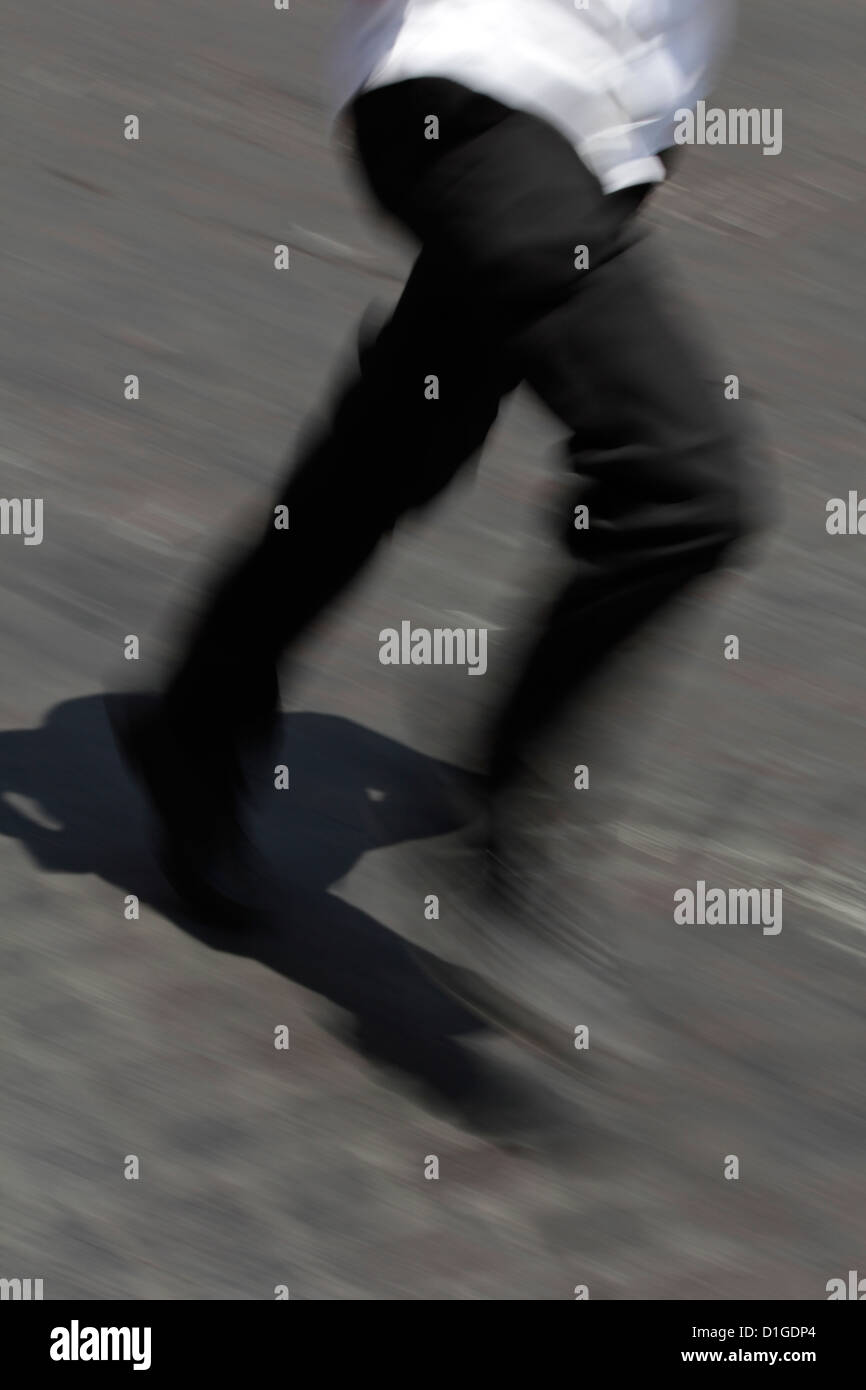 man running fast on street road Stock Photo - Alamy