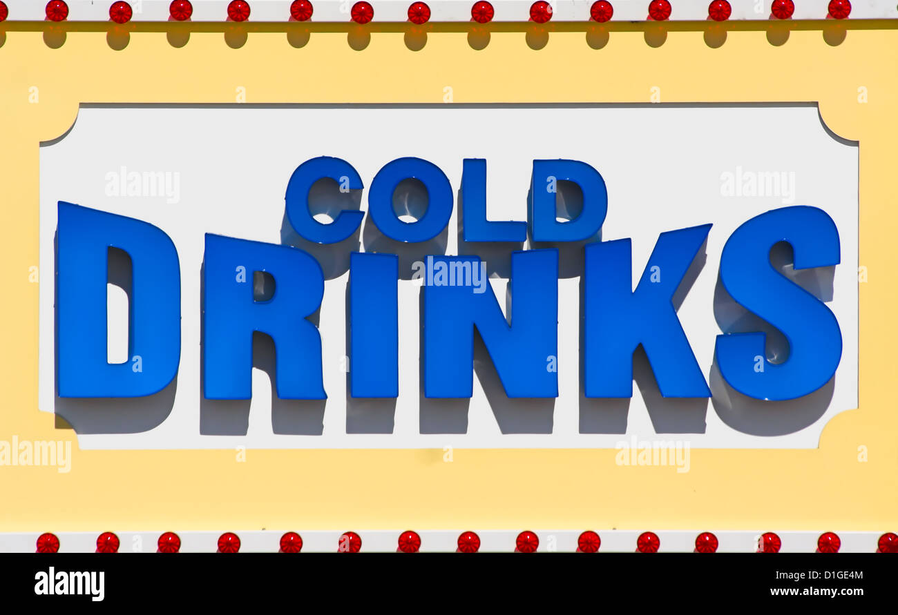 Large sign advertising cold drinks for a restaurant on a beach ...