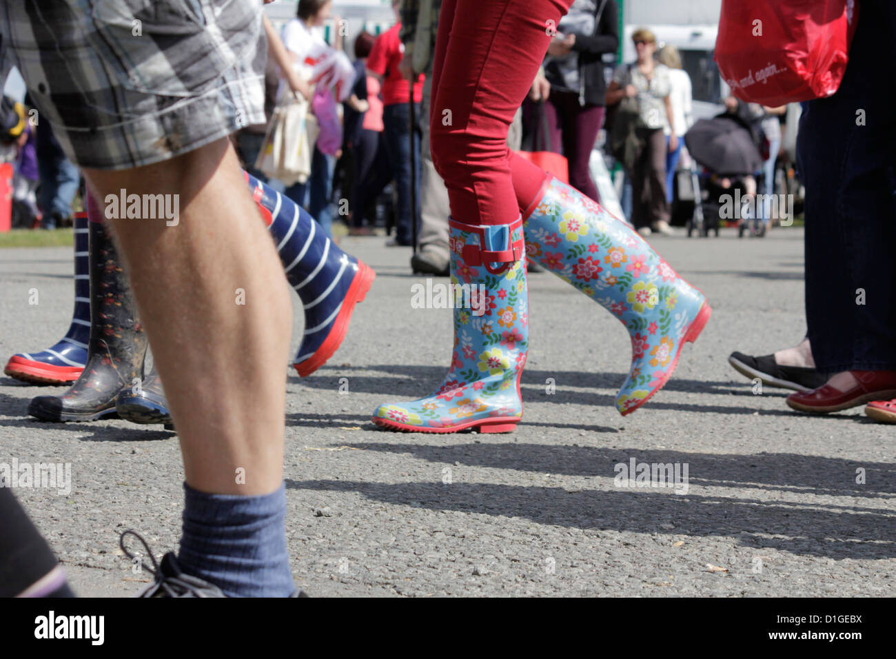 young women wearing colourful designer wellington boots Stock Photo - Alamy