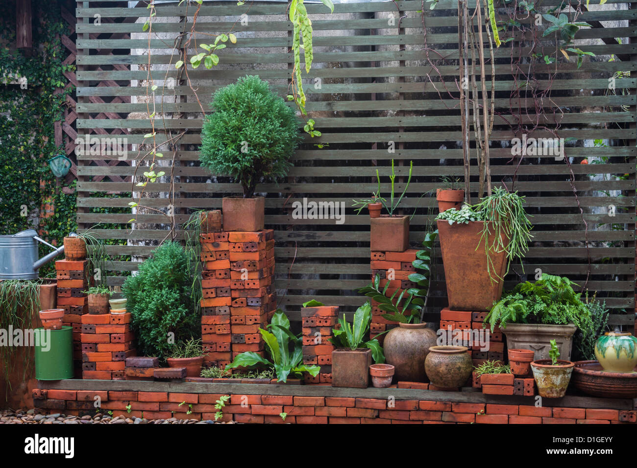 Backyard decorated with some tree and flower Stock Photo - Alamy