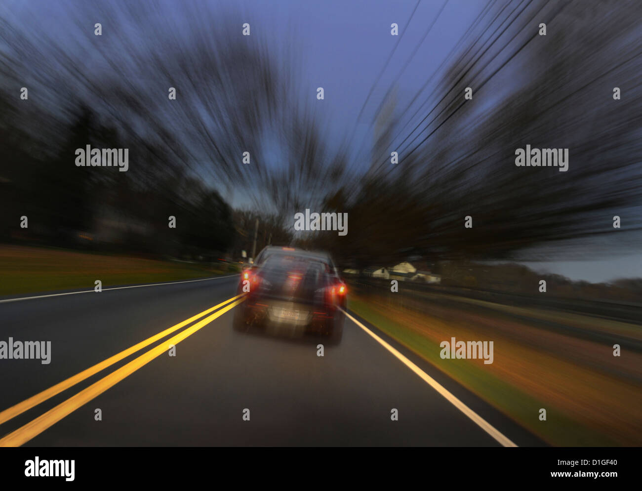 Cars driving down a street hi-res stock photography and images - Alamy
