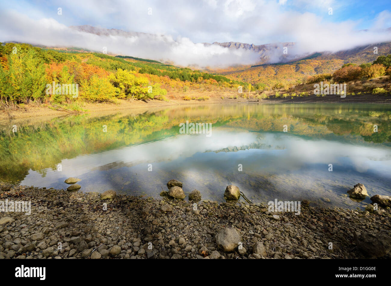 Mountain landscape with reflections in a deep quiet lake Stock Photo ...
