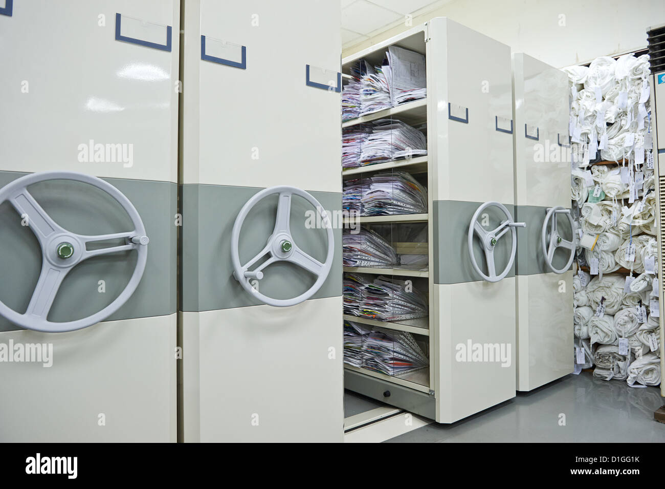Shelves of disorganized stored fabric samples Stock Photo - Alamy