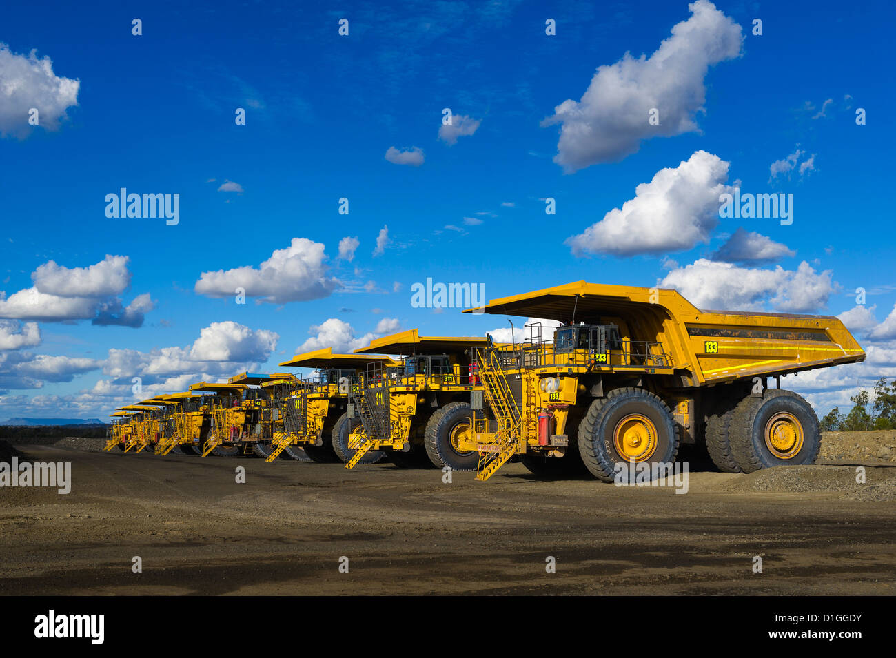 Dump trucks row hi-res stock photography and images - Alamy