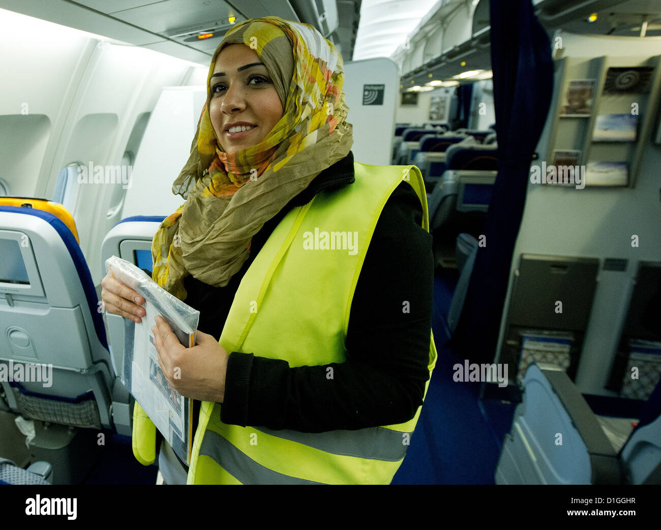 Asssistants look for so-called 'Loose items' in an Airbus A-340 ...