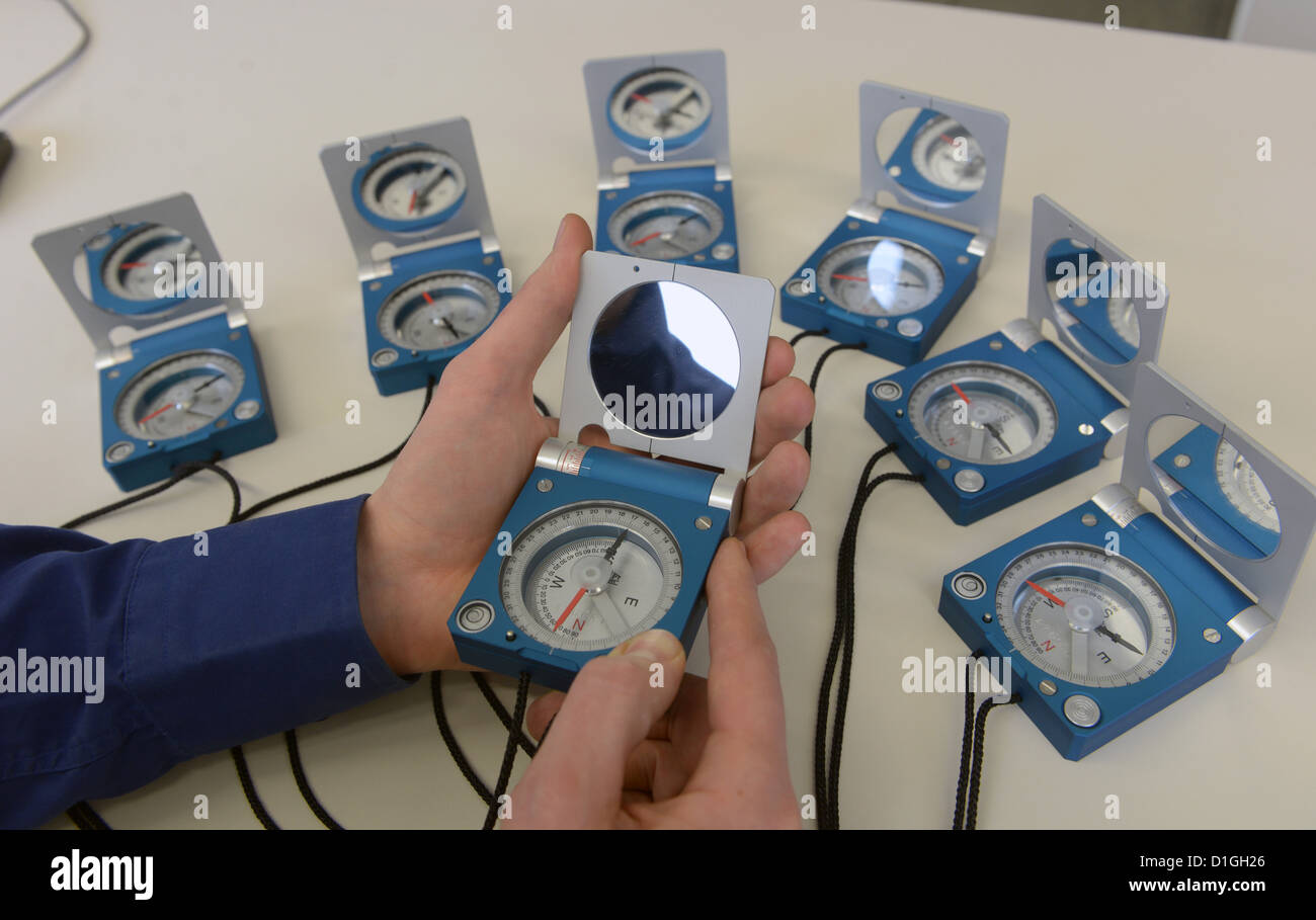 An employee of the German producer of surveying instruments and ...