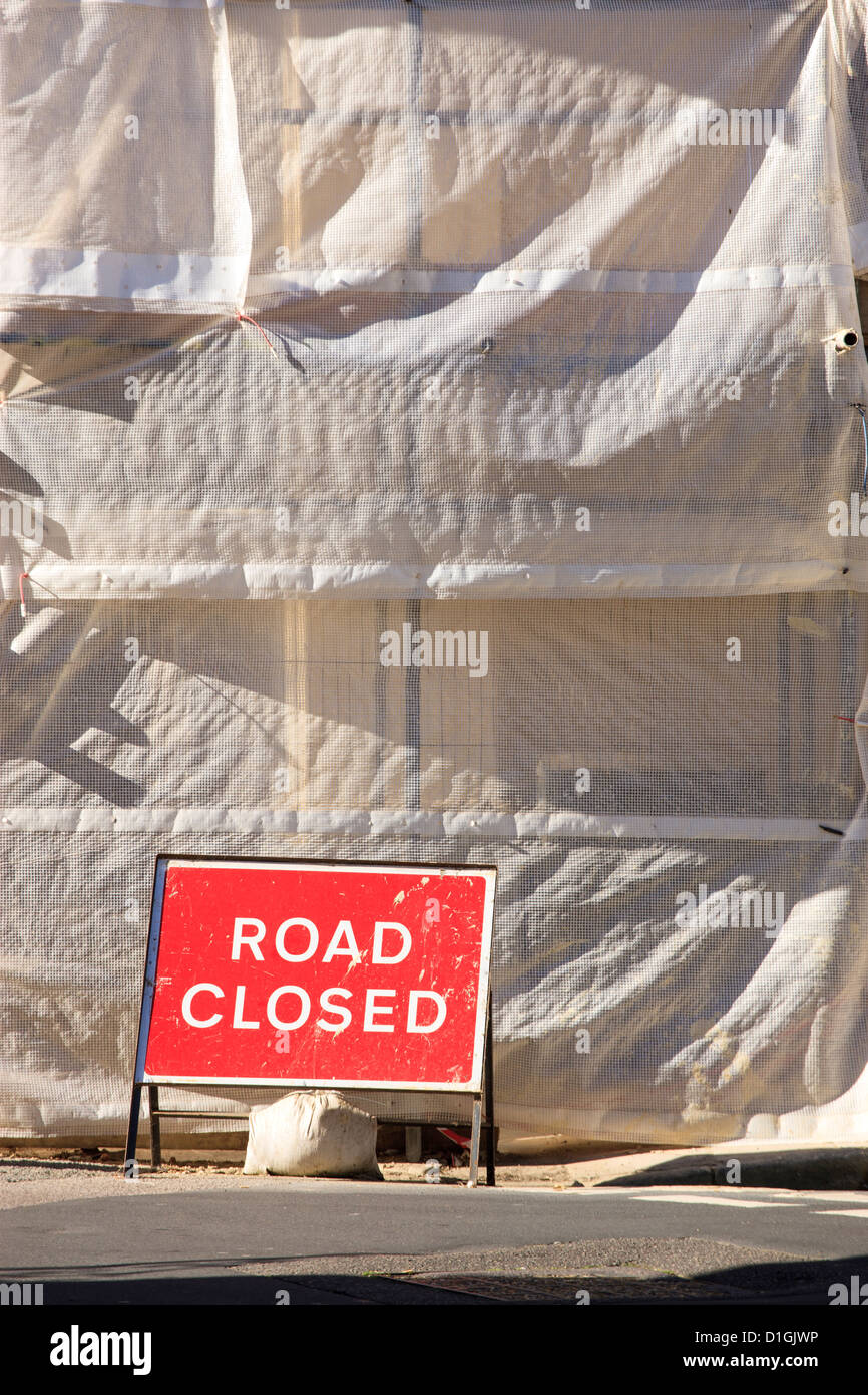 Road Closed sign with scaffolding Stock Photo - Alamy