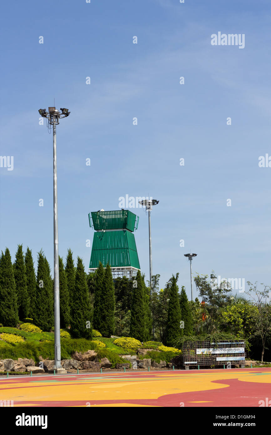 3 Spotlight Posts and Green Tower Stock Photo - Alamy