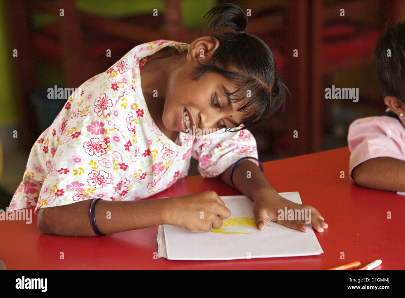 Mettupalayam, India, a mentally disabled girl while painting a picture ...