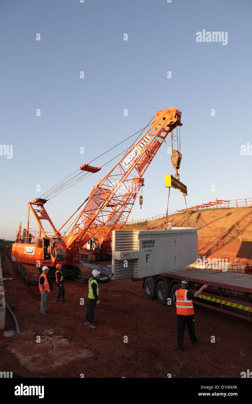 Two large cranes craning in Bebo pre-cast concrete sectional arch ...