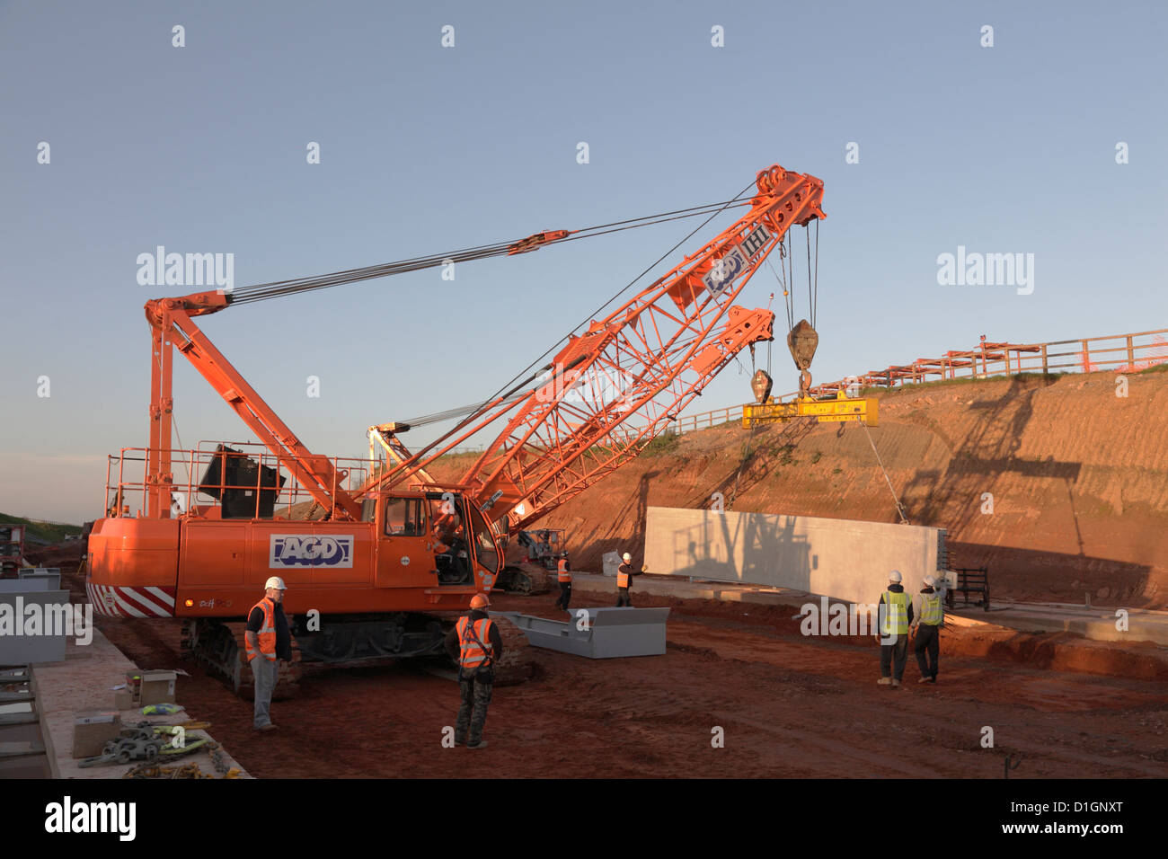 Two large cranes craning in Bebo pre-cast concrete sectional arch ...