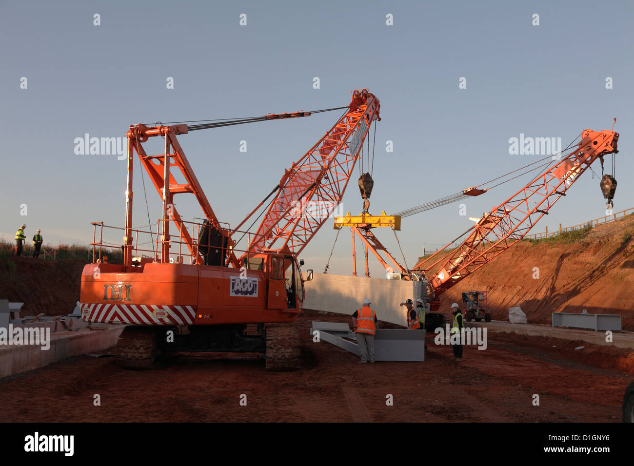 Two large cranes craning in Bebo pre-cast concrete sectional arch ...