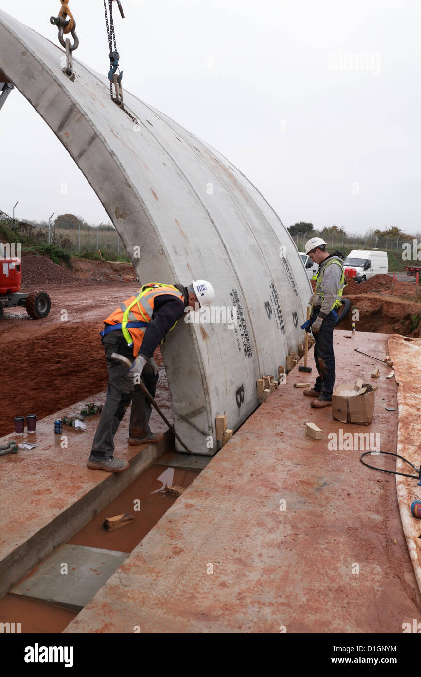 Careful positioning craning in of Bebo pre-cast concrete sectional arch ...