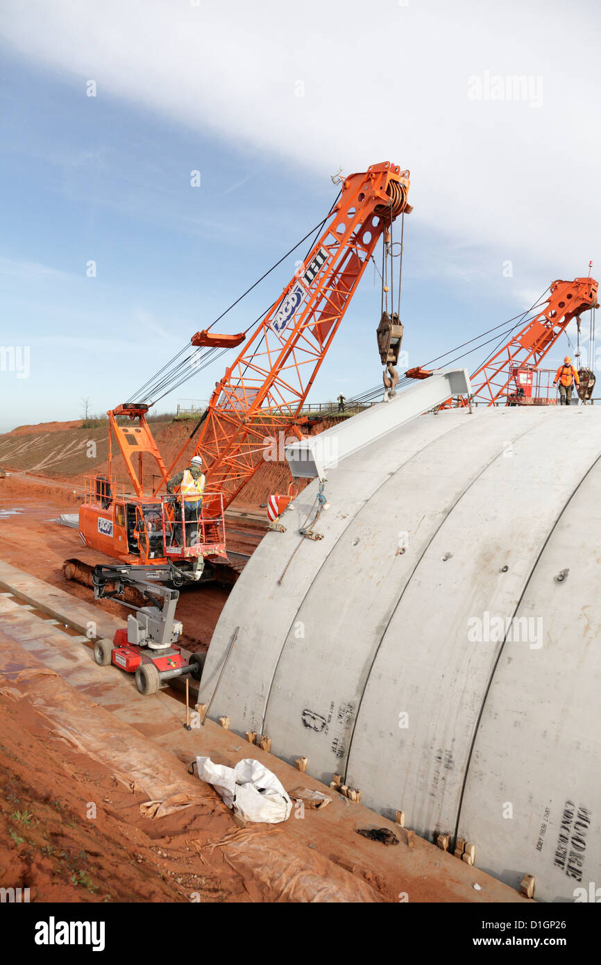 Bebo Arch bridge of precast reinforced concrete sections being lifted ...