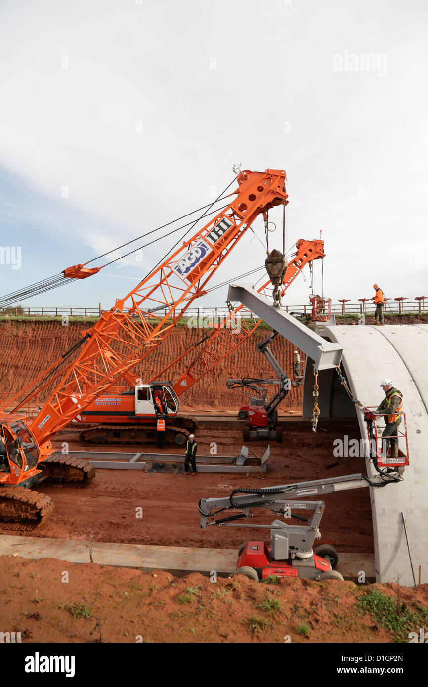 Bebo Arch bridge of precast reinforced concrete sections being lifted ...