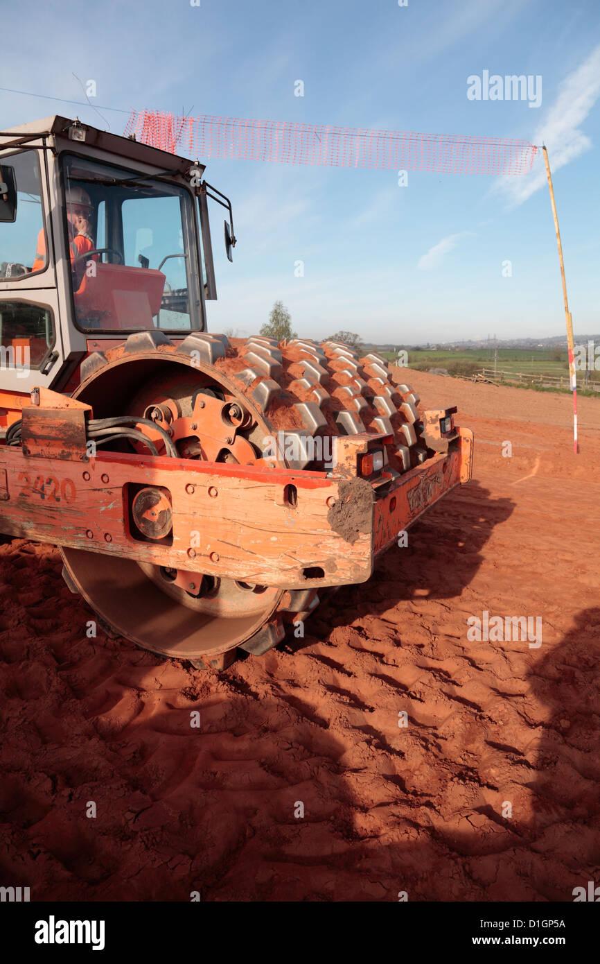 Sheeps foot roller compacting rolling fill material earthmoving ...