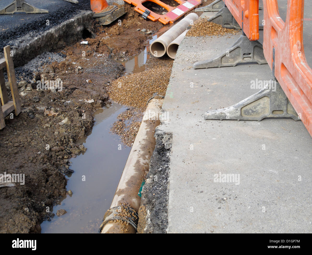 Repairing damaged urban surface water drainage pipe crumbling ...