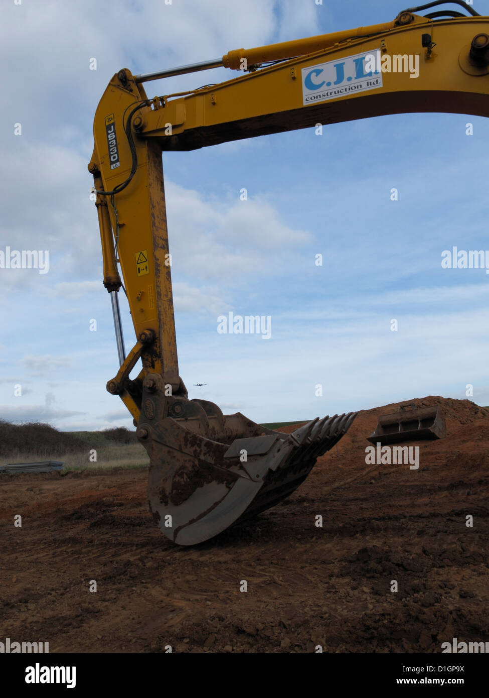Toothed Bucket of large tracked digger at rest on new road scheme UK ...