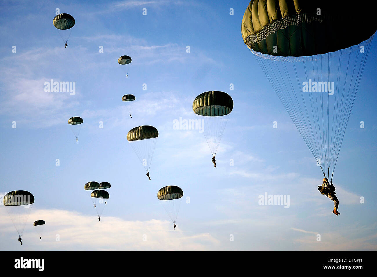 US Army Soldiers descend from an aircraft during Operation Toy Drop on ...